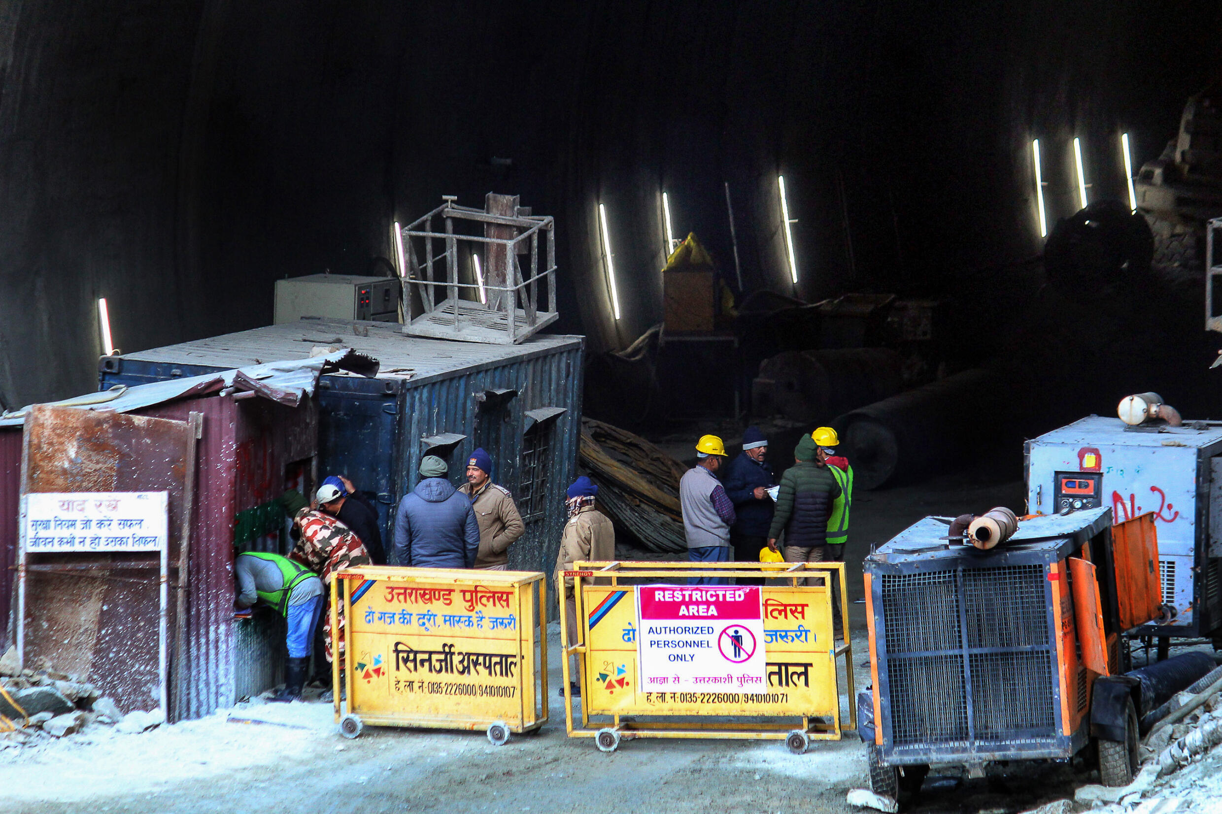 India tunnel rescue efforts paused over fears of cave-in
