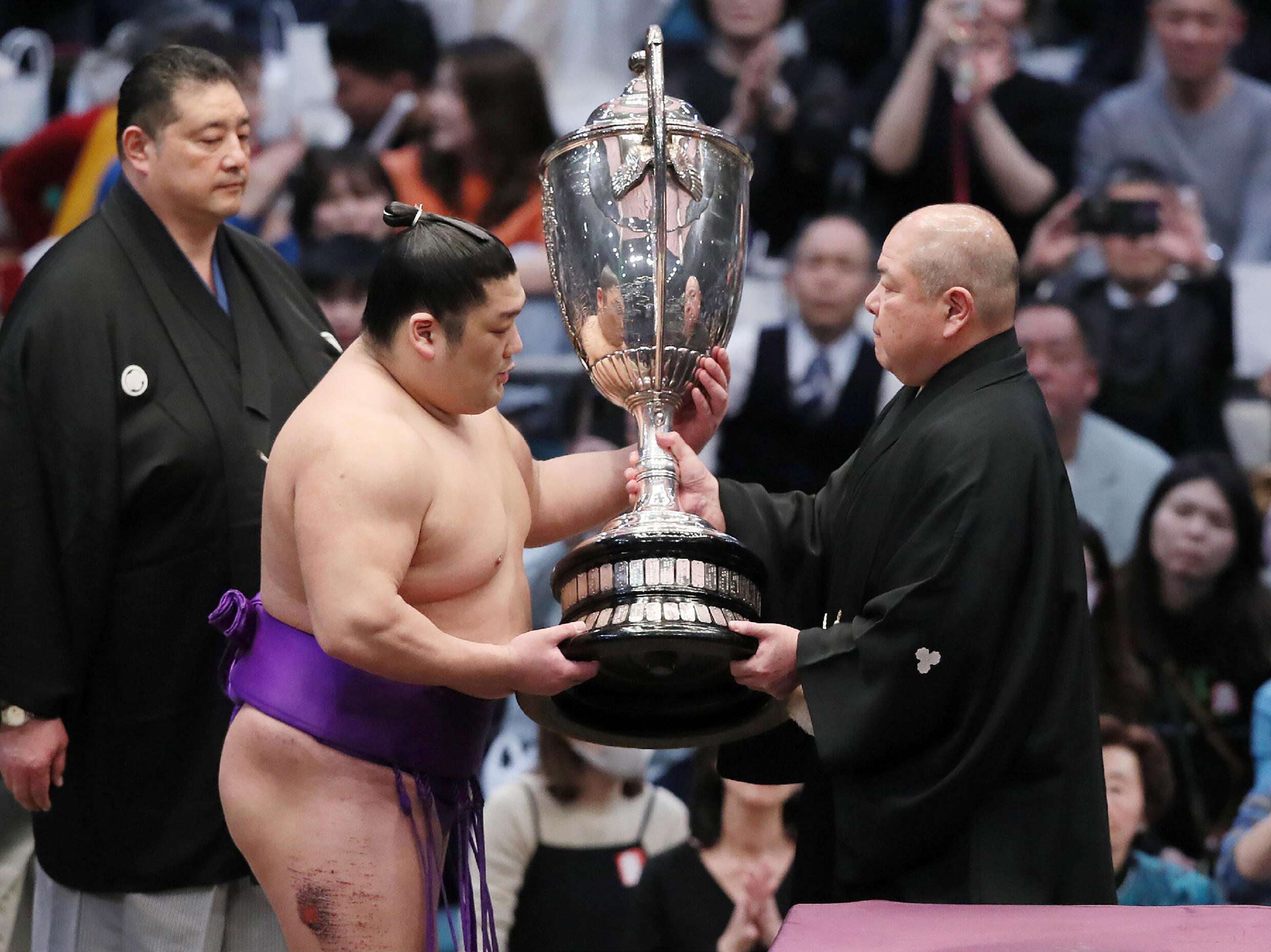 Rookie makes sumo history after winning top tournament