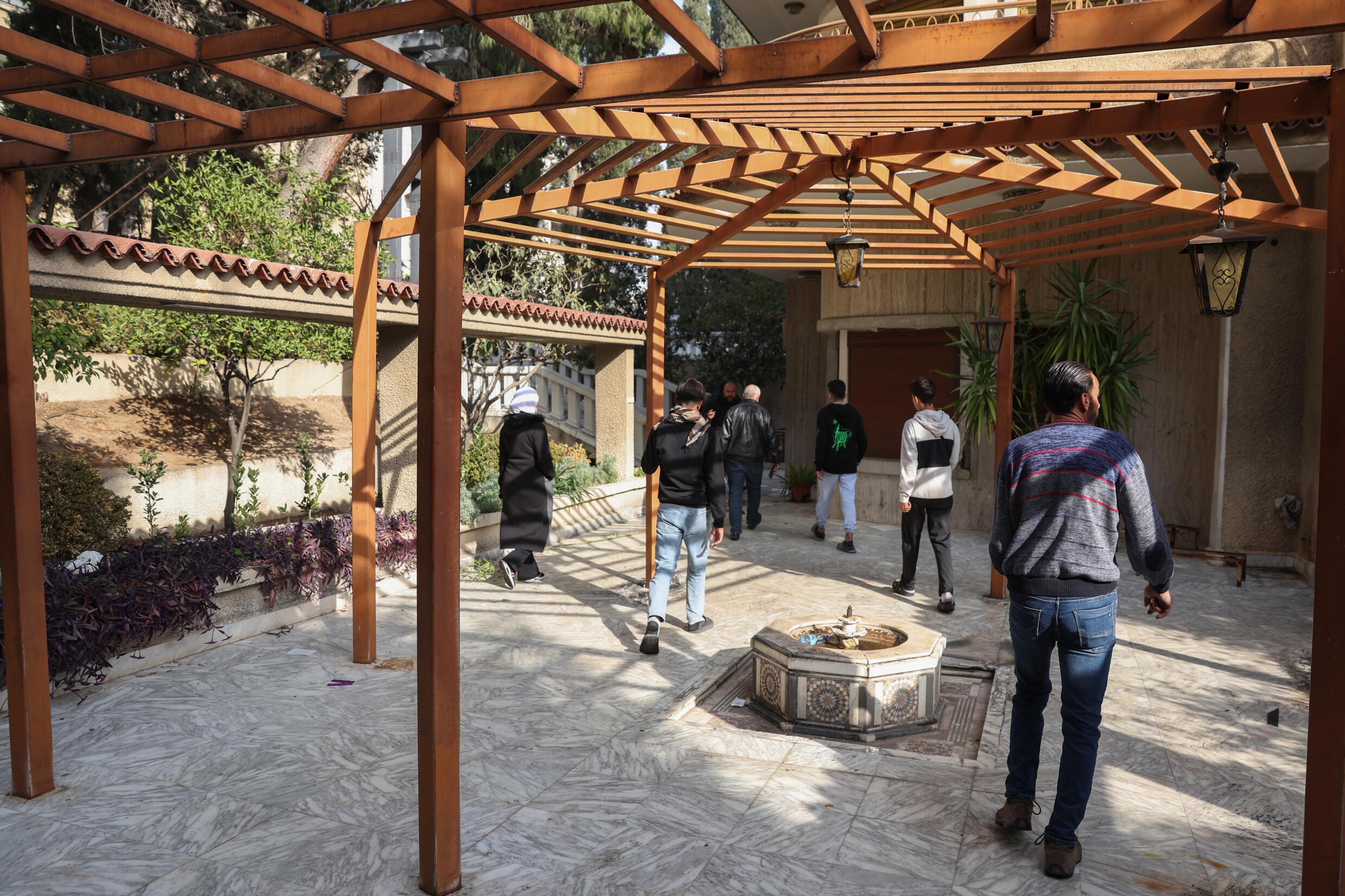 Syrians explore ousted Assad's Damascus home