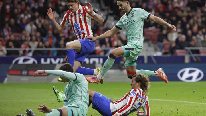 Griezmann double earns Atletico battling win over Levante