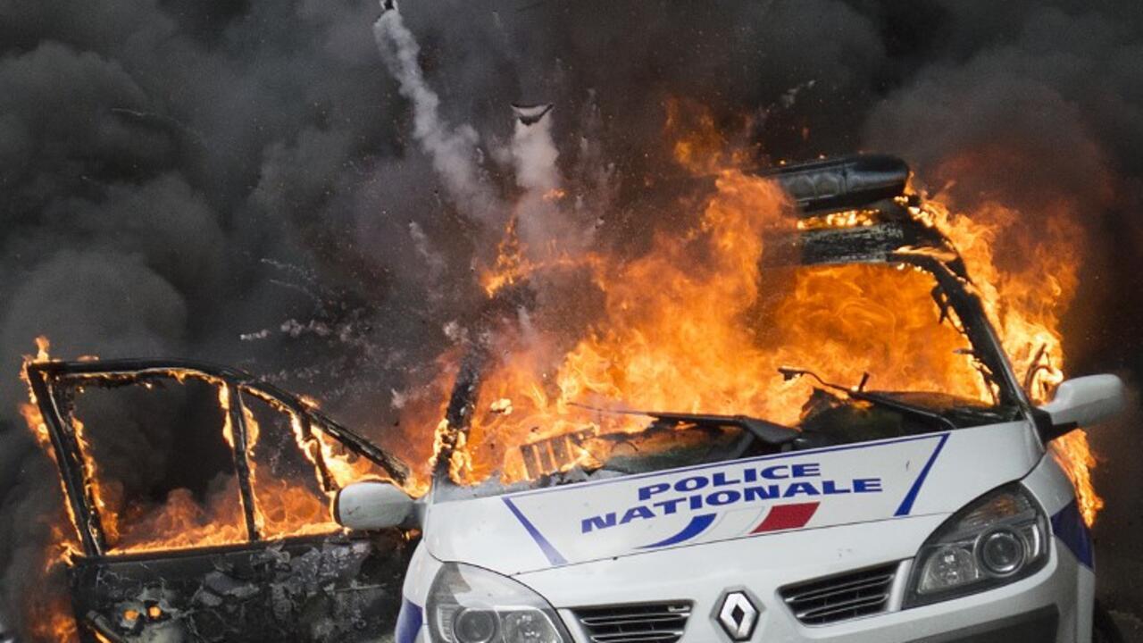 Trial for protesters who set Paris police car on fire