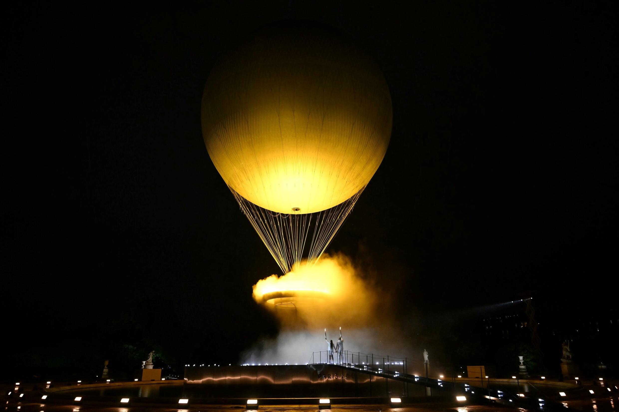 Historic river parade, Dion show-stopper ignite Paris Olympics