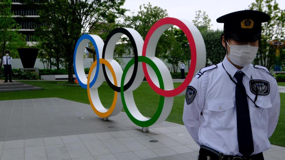 Japan extends state of emergency until a month before Olympics