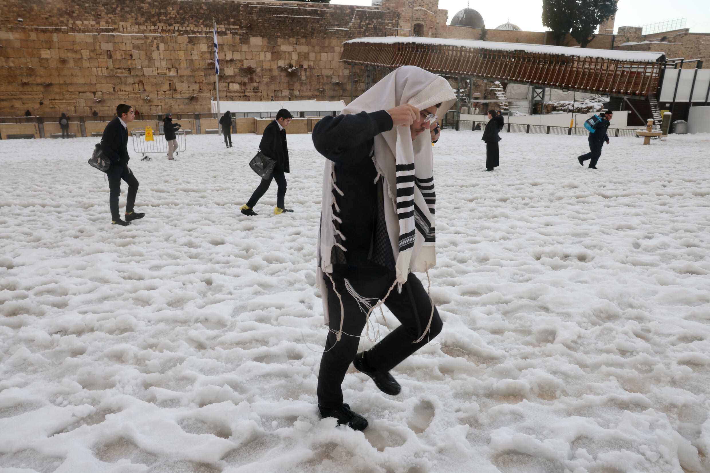 Rare Mideast snow brings Jerusalem joy, misery for Syria refugees