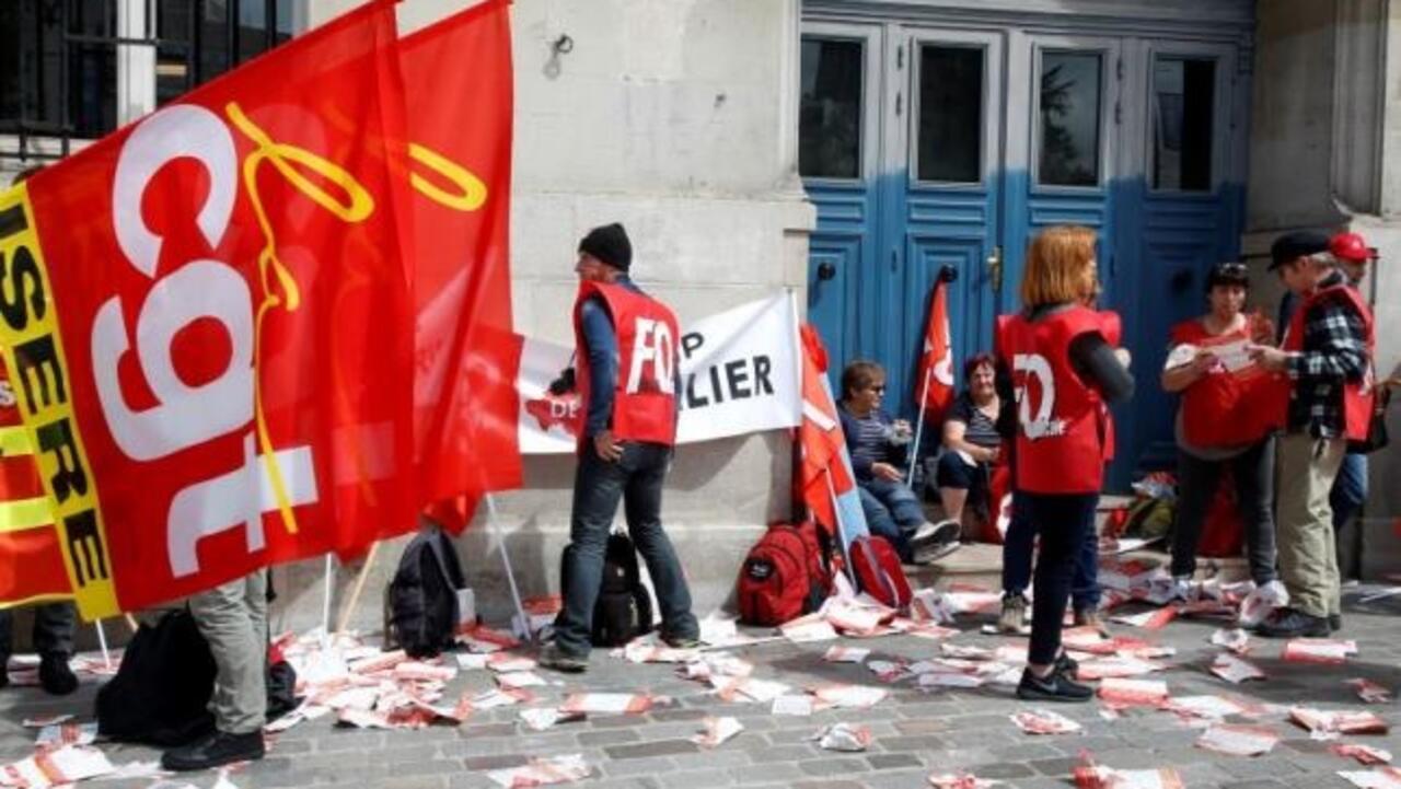 French unions protest as labour law goes to parliament