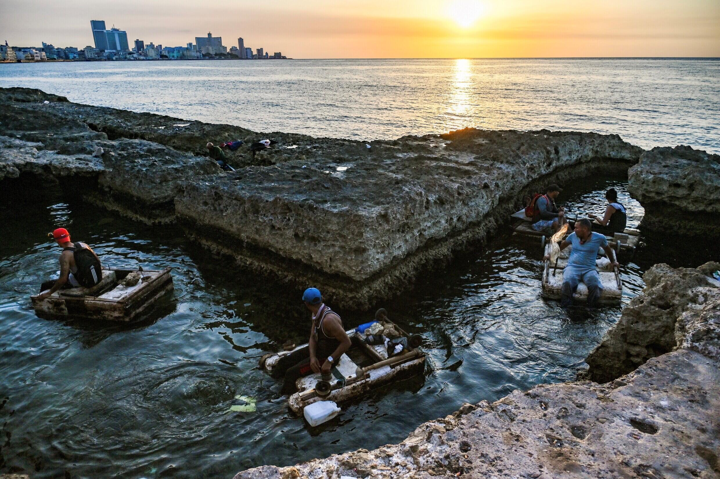 With no money or fuel, Cuban fishermen improvise on floating rafts