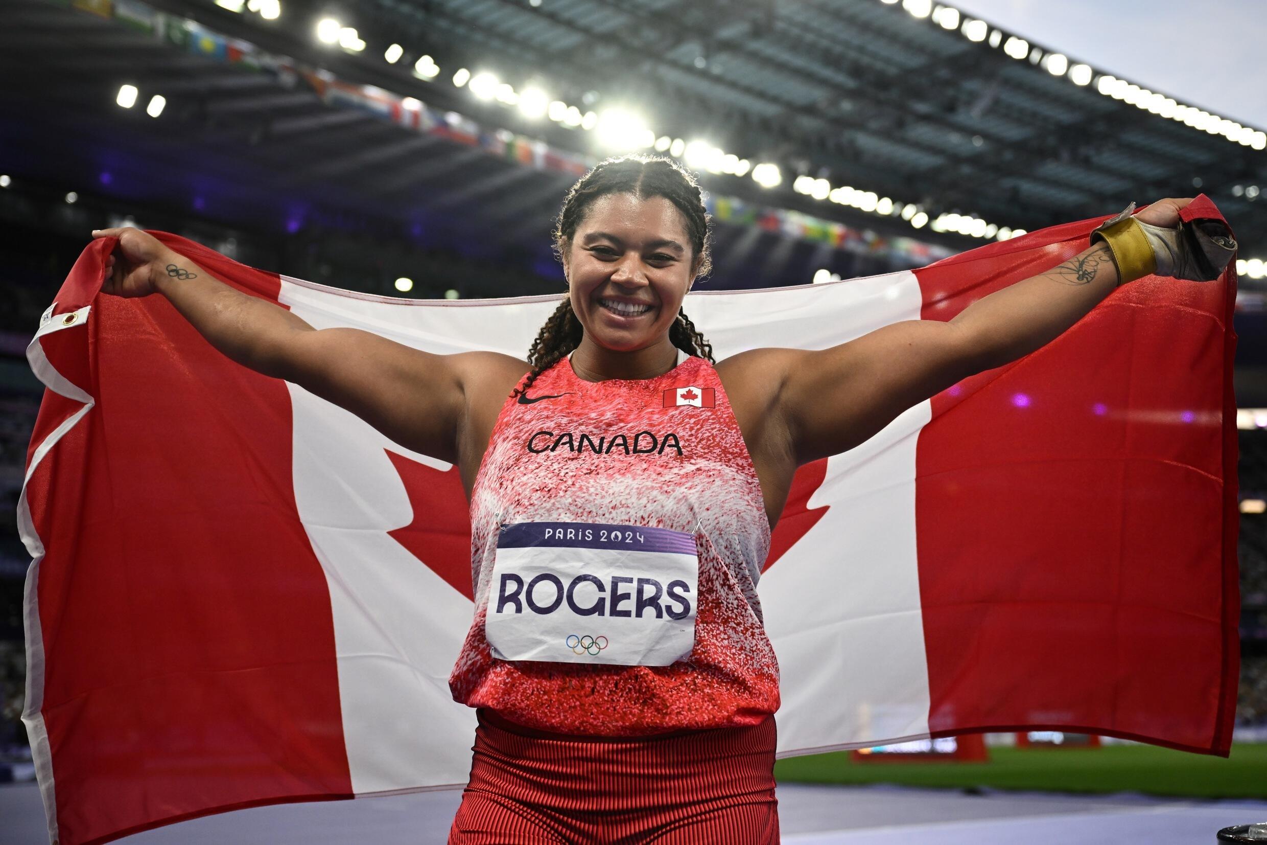 Thomas takes Olympic 200m, Hocker streaks to shock 1500m victory