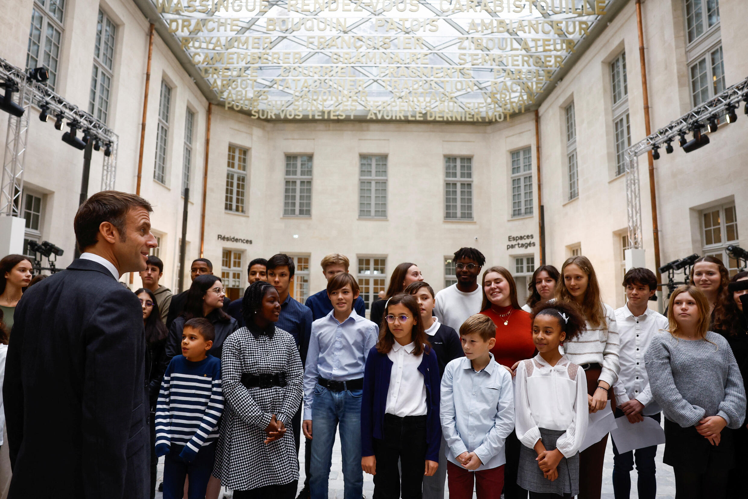 Macron opposes gender neutral writing as he opens language museum