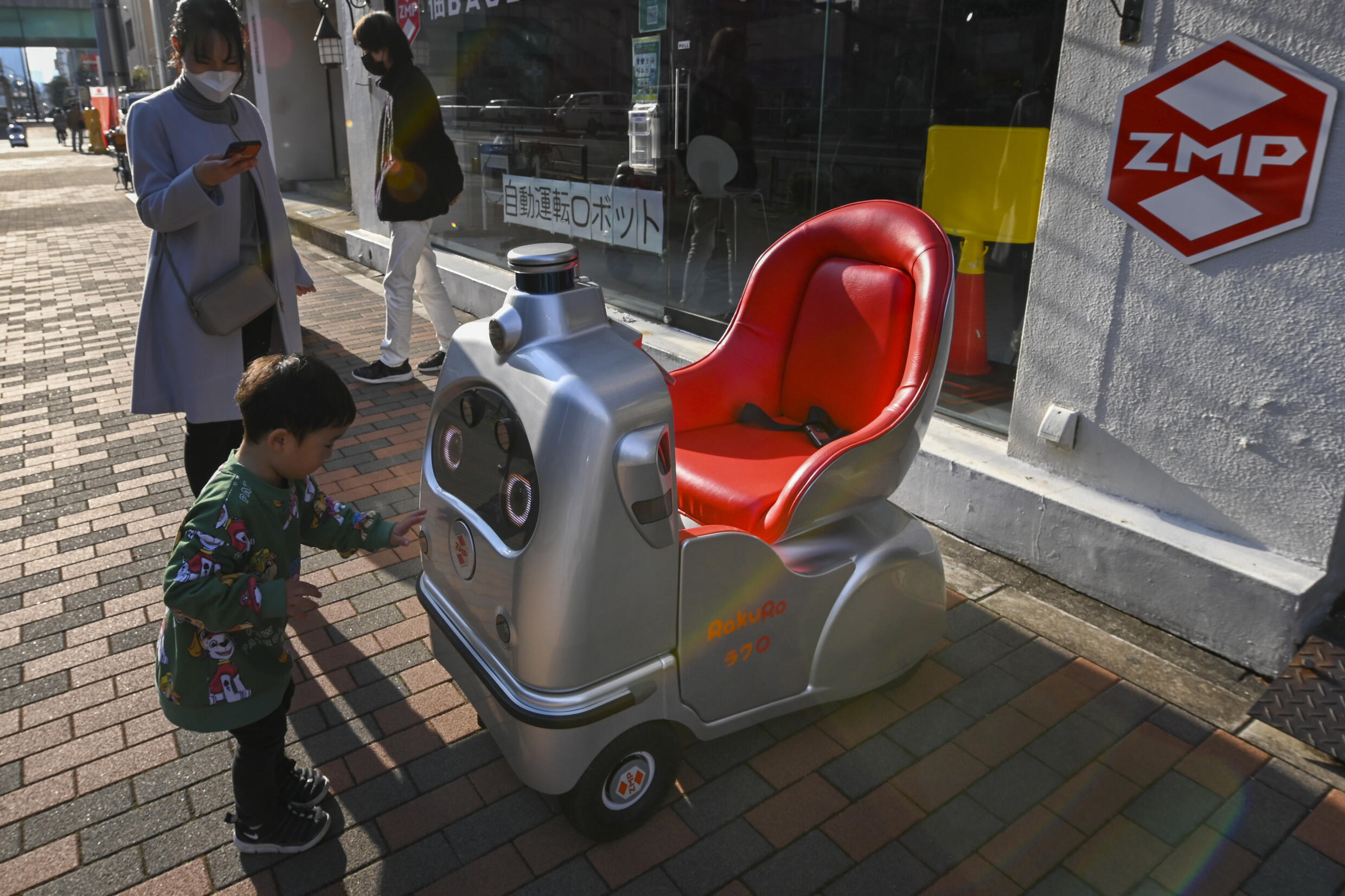 Japan rolls out 'humble and lovable' delivery robots
