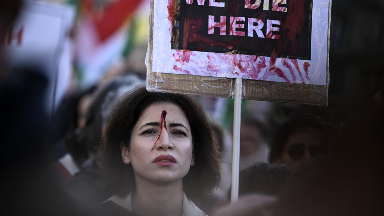 Thousands march in France to back Iranian protesters