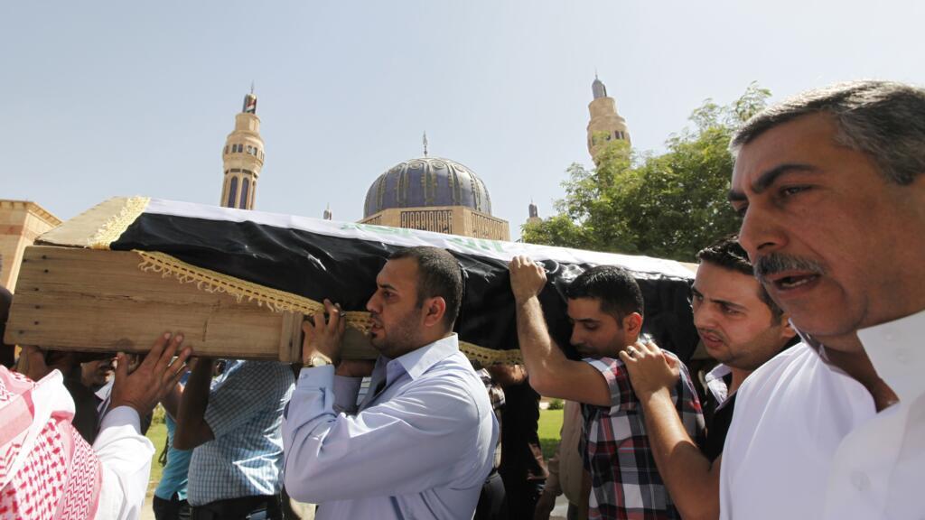Mourners gather at Umm al-Qura mosque in Baghdad for blast victims