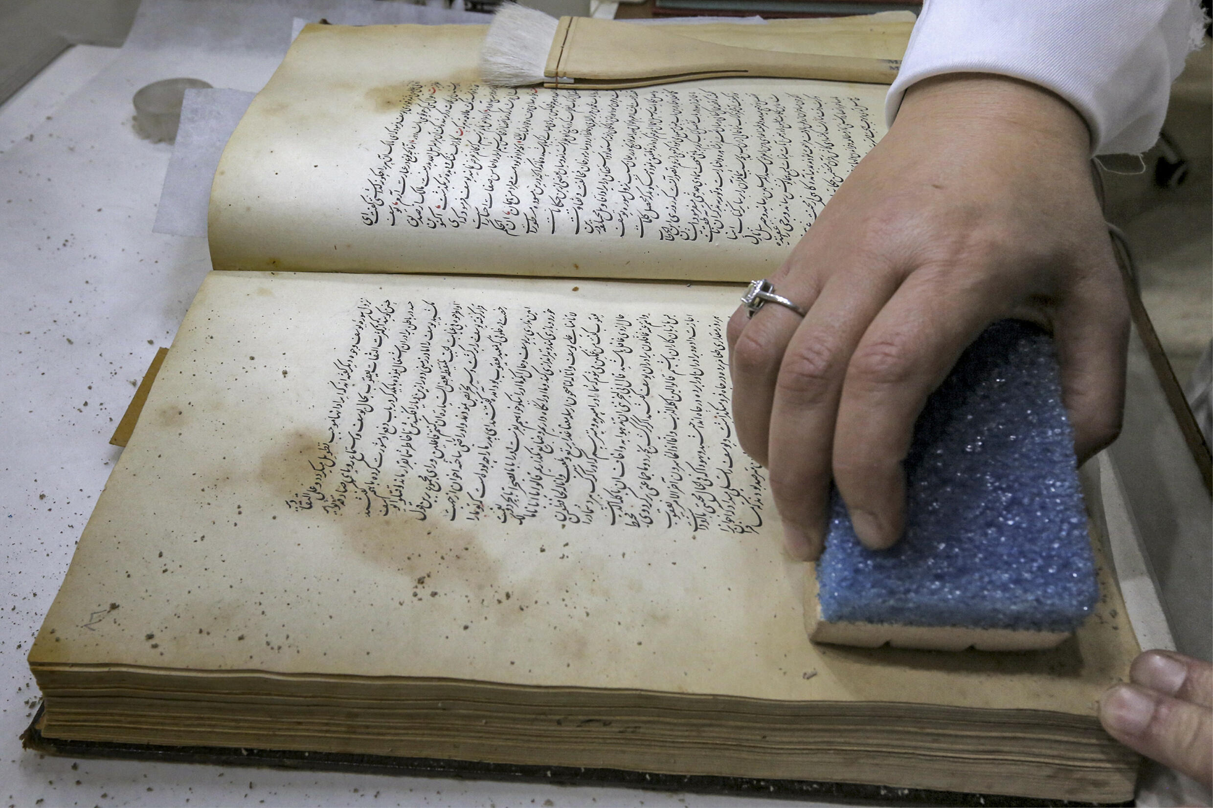 Iraqi conservators strive to preserve ancient manuscripts