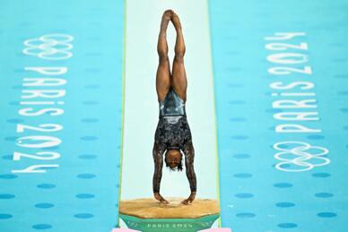 Biles dazzles in Paris Olympics debut despite injury scare